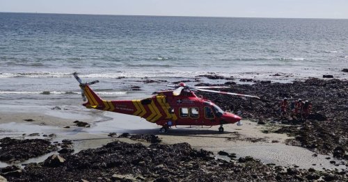 Coastguard and Cornwall Air Ambulance rescue injured person from beach ...