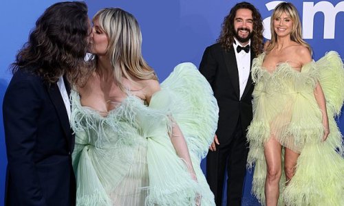 Braless Heidi Klum suffers a wardrobe malfunction in incredible but daring yellow cut-out gown ...