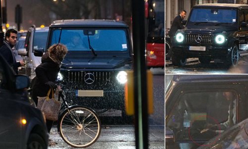 David Beckham is seen parked illegally and using a phone at the wheel ...