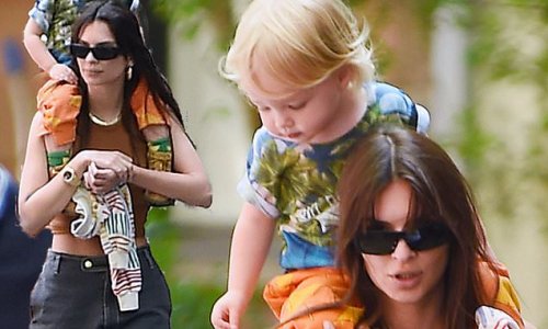 Emily Ratajkowski carries her toddler Sylvester on her shoulders as she ...