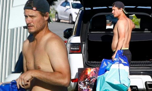 Shirtless Lleyton Hewitt shows off his dad bod in a pair of boardies as ...