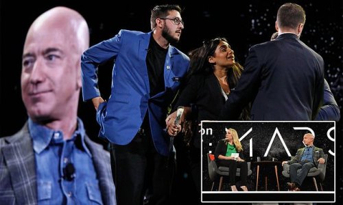 Shocking moment Jeff Bezos is rushed on stage by a protester at a $2k-a ...