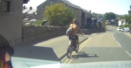 Moment 'idiot' e-bike rider swerves in front of car and onto wrong side ...