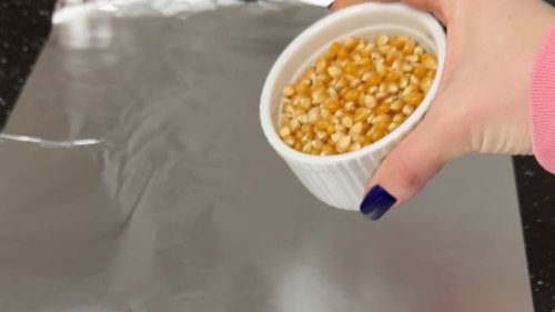 Girl wraps corn kernels in aluminum foil and makes perfect popcorns ...