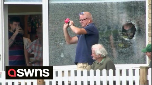 Cricket player smashes ball for six straight through clubhouse window ...