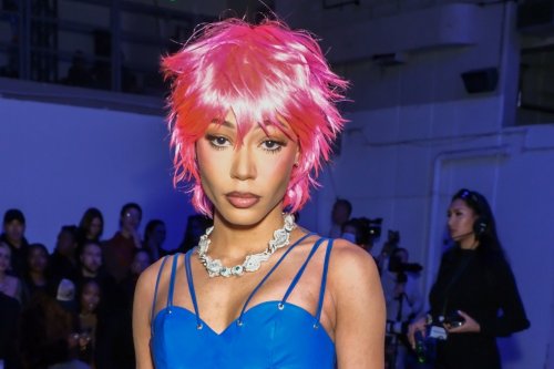 Coi Leray Laces Into Blue Leather Dress & Swirling Wedge Boots at ...