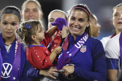 Alex Morgan Posts Iconic Photo Holding Her Daughter After Signing New ...