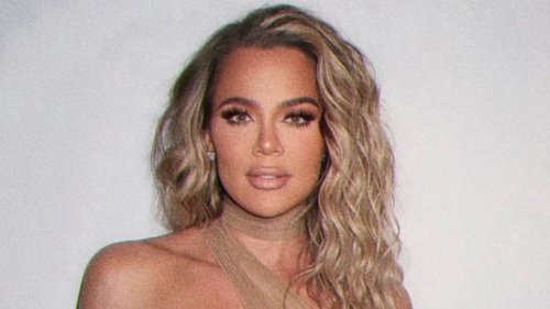 Khloe Kardashian shows off pin-thin waist in skintight pink catsuit as she boards sister Kylie ...